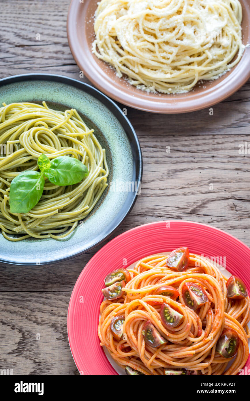 Portions of colorful spaghetti with ingredients Stock Photo - Alamy