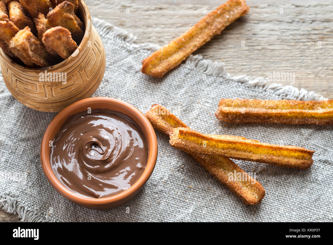 Churros - famous Spanish dessert with chocolate sauce Stock Photo - Alamy