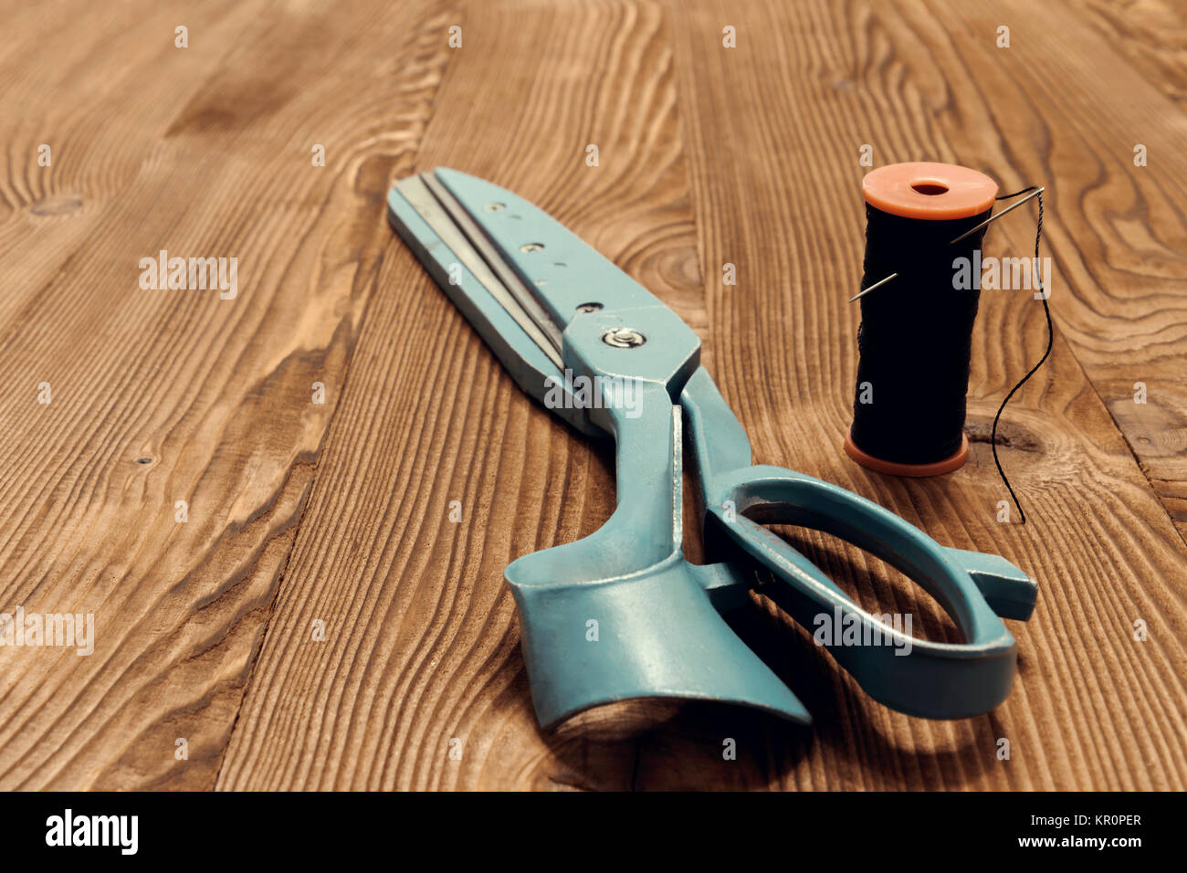 Old coil of threads and old scissors, thread for sewing. wooden ...