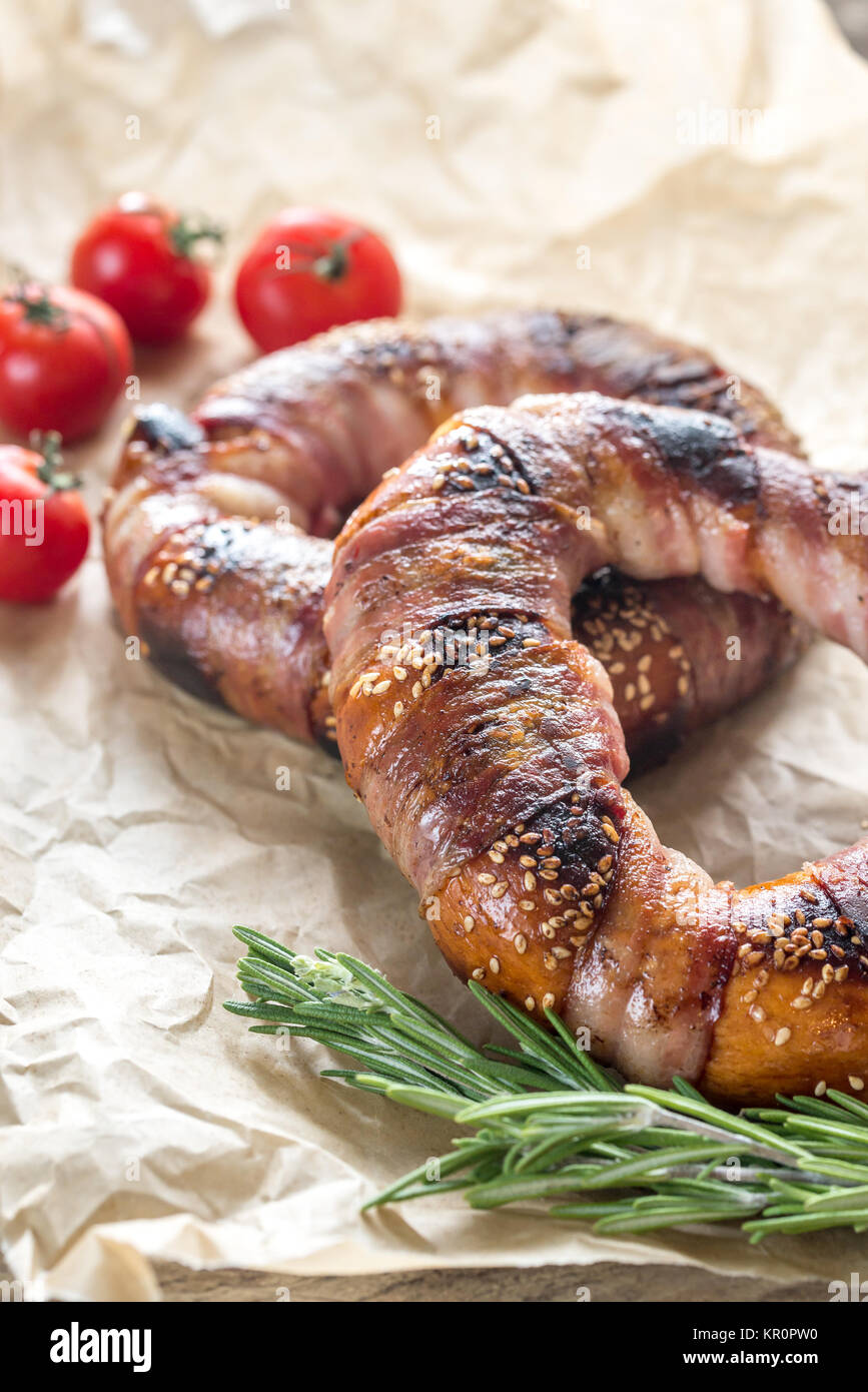 Bagels with sesame wrapped in bacon rashers Stock Photo - Alamy