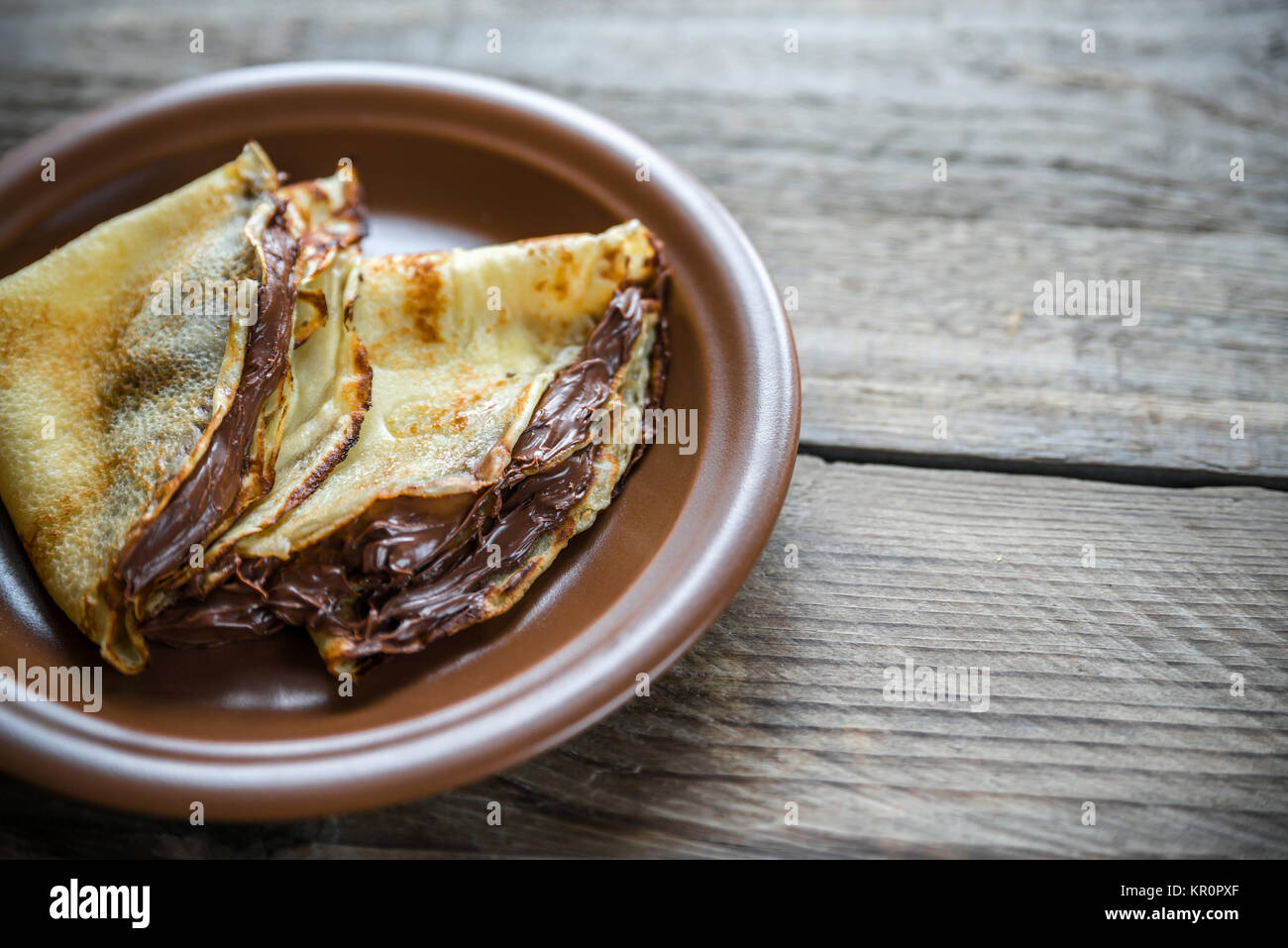 Crepes dark chocolate sauce hi-res stock photography and images - Alamy