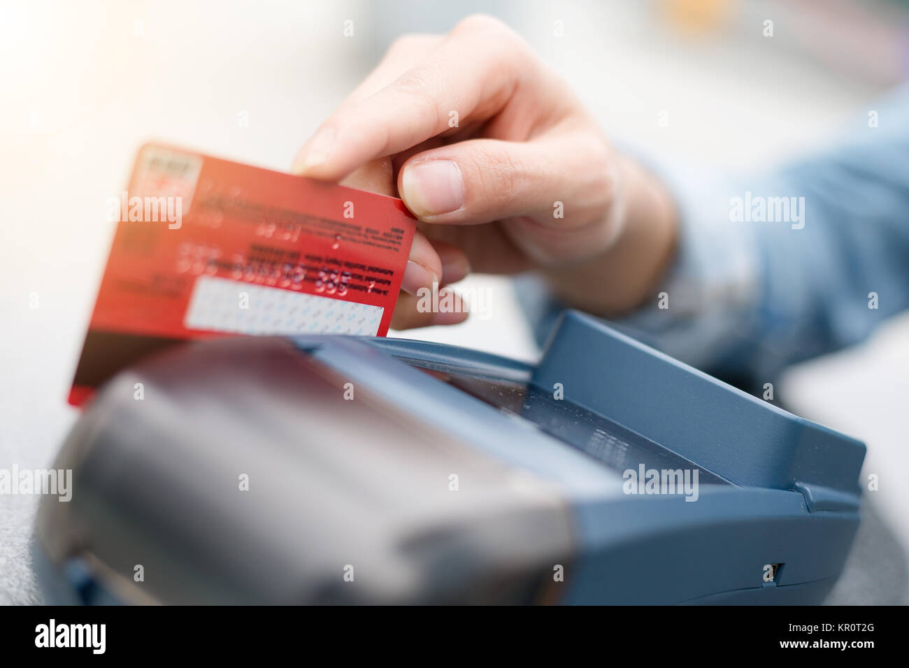 Debit card swiping on card reader device Stock Photo - Alamy