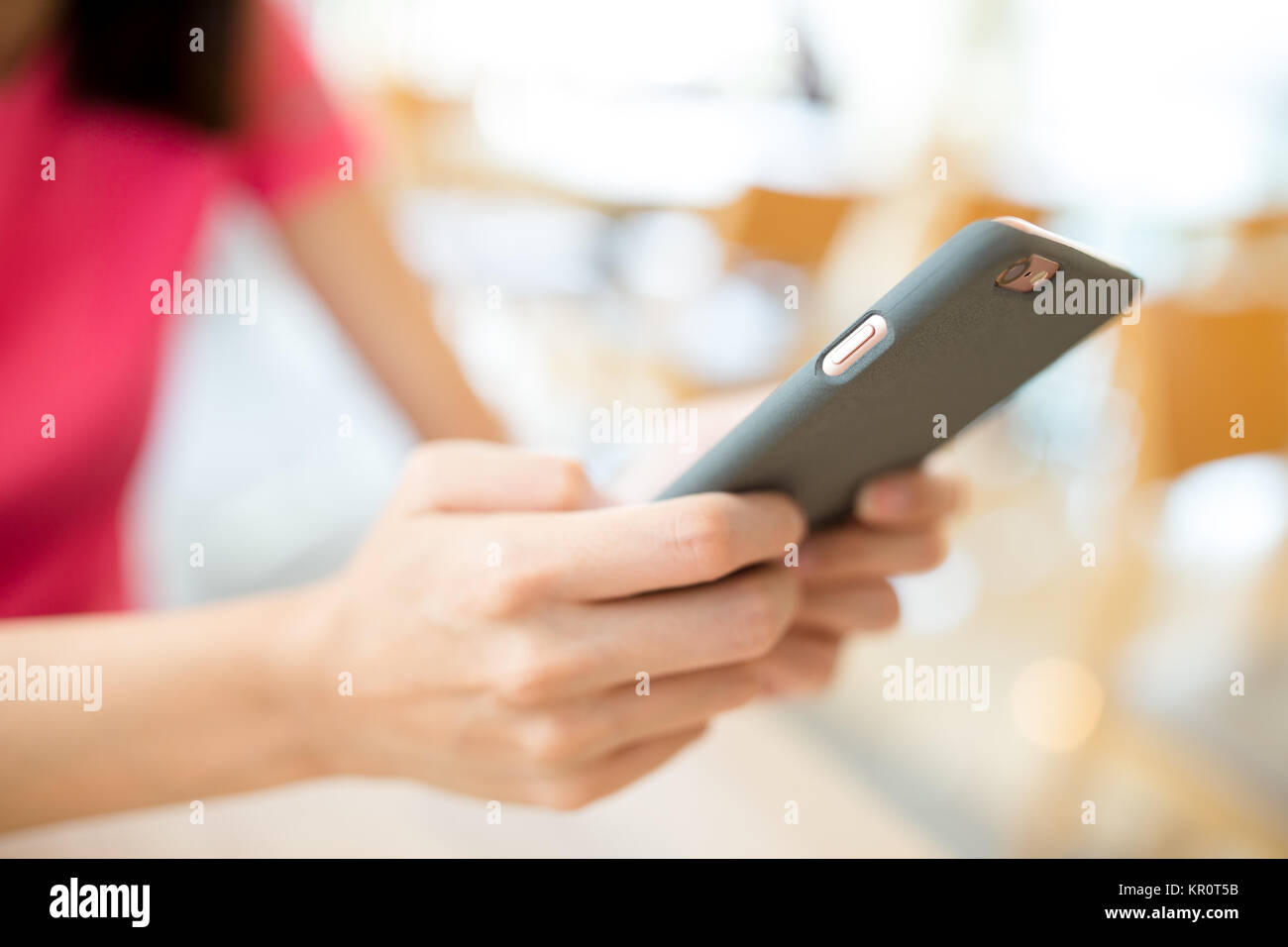 Woman browsing internet on mobile phone Stock Photo - Alamy