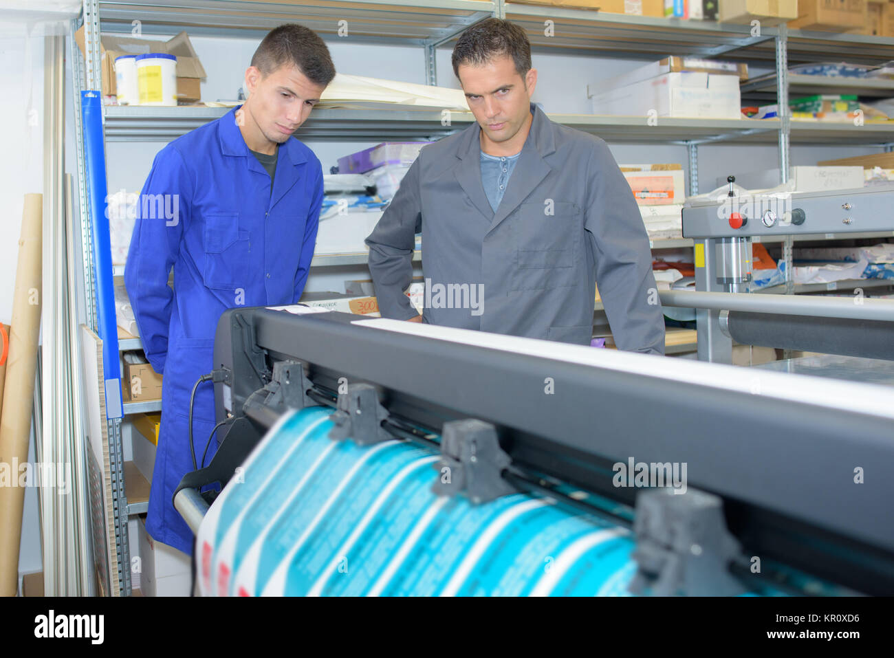Printer with apprentice hi-res stock photography and images - Alamy