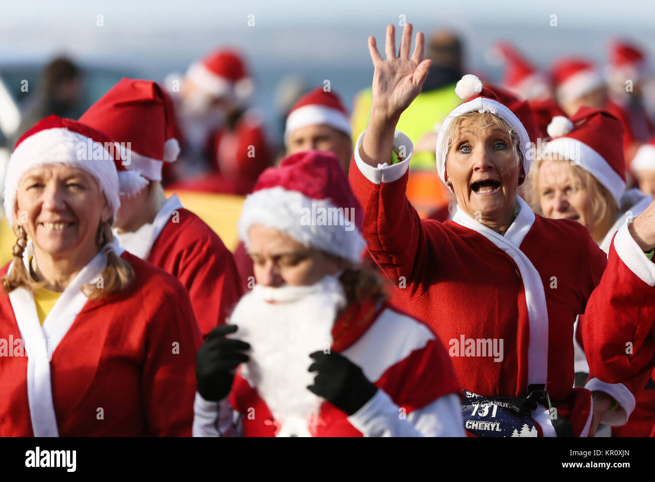 Pictured: Runners in Santa Claus fancy dress take part in this year's ...