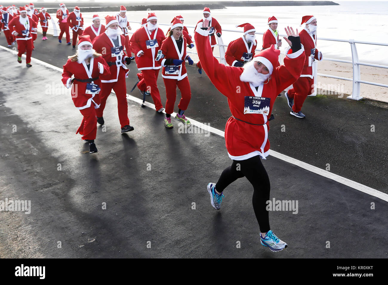 Pictured: Runners in Santa Claus fancy dress take part in this year's ...