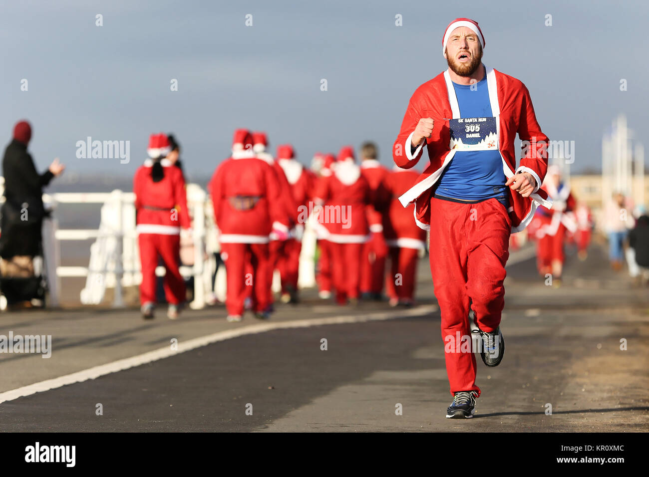 Pictured: Runners in Santa Claus fancy dress take part in this year's ...