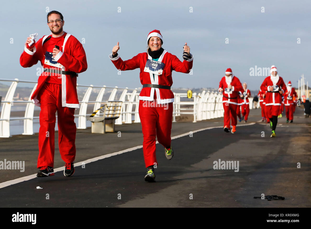 Pictured: Runners in Santa Claus fancy dress take part in this year's ...