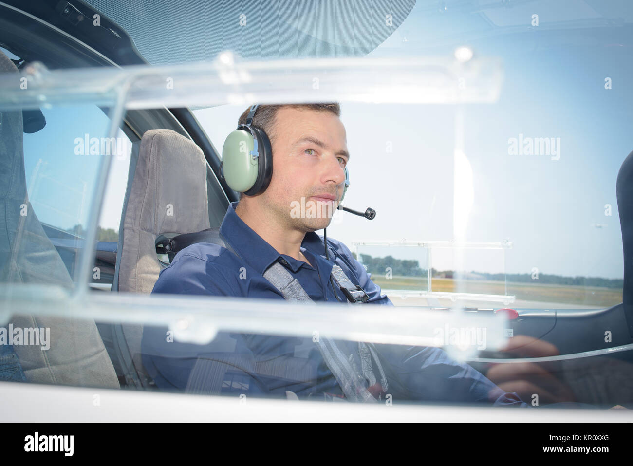 Side view of pilot in aircraft Stock Photo - Alamy