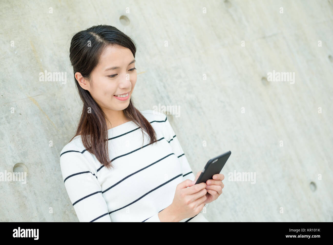 Asian Woman use of mobile phone Stock Photo - Alamy