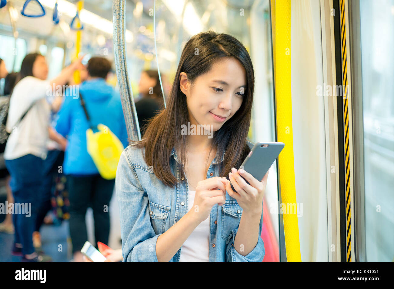 Woman cellphone train compartment hi-res stock photography and images ...