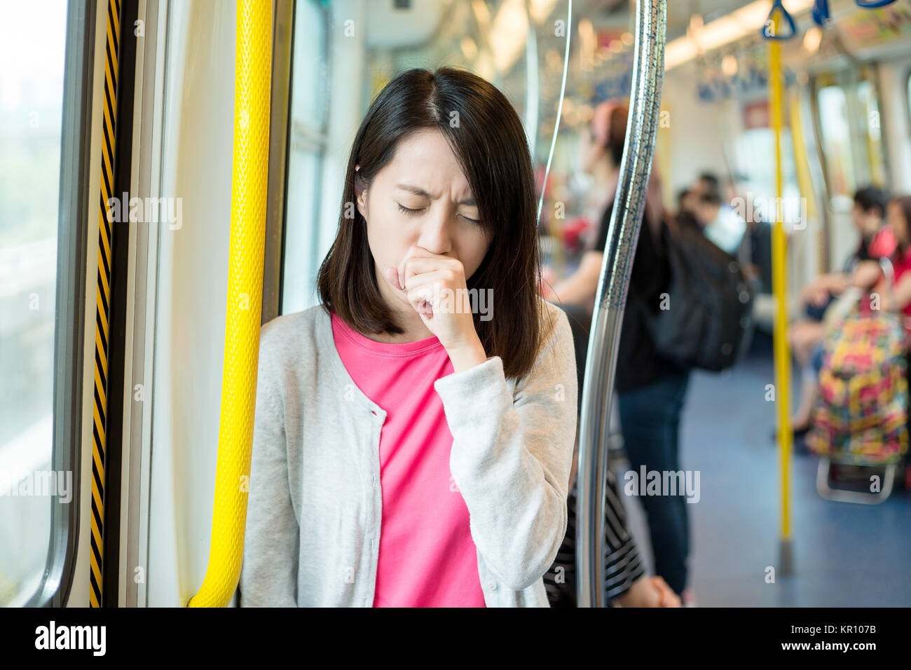Woman feeling unwell inside train Stock Photo - Alamy