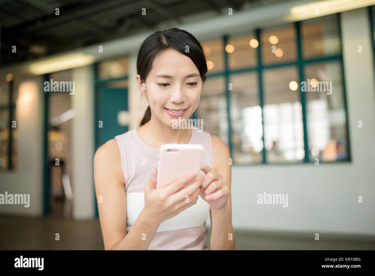 Woman use of cellphone Stock Photo - Alamy