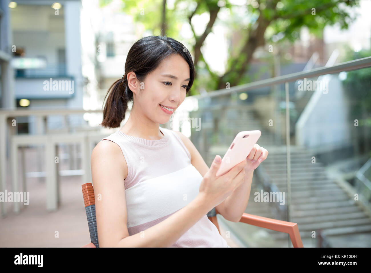Woman use of mobile phone Stock Photo - Alamy