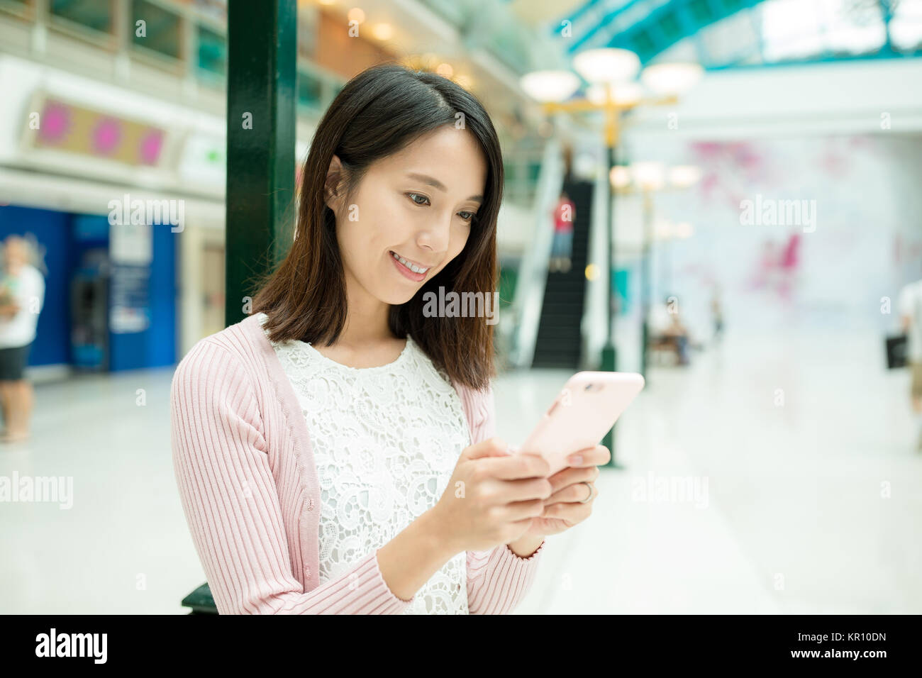 Woman watching on cellphone Stock Photo - Alamy