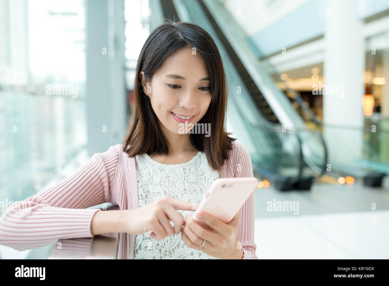Woman browsing on cellphone Stock Photo - Alamy