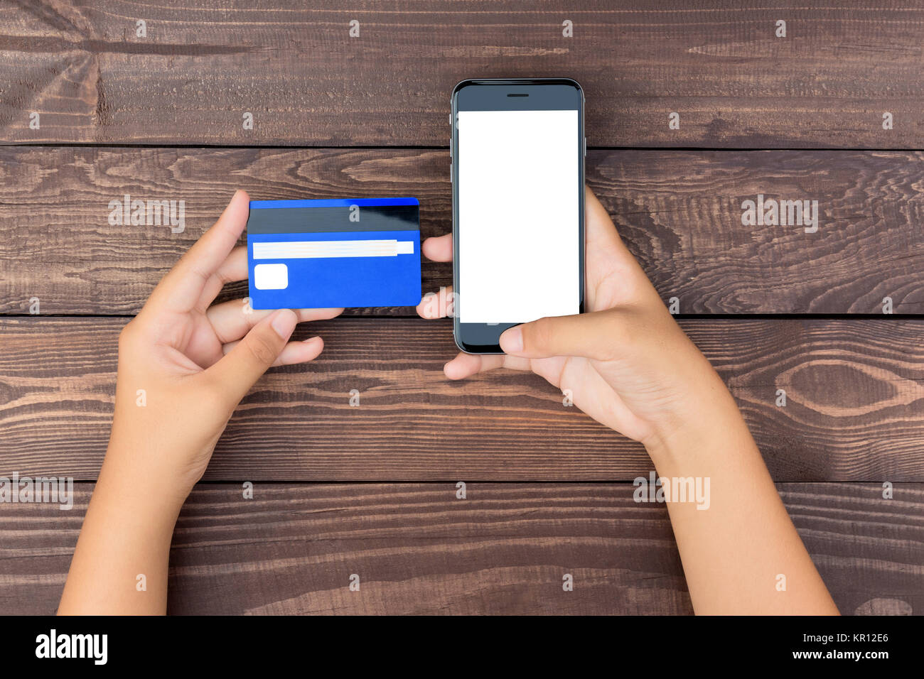 closeup hand use phone and credit card on table top view Stock Photo ...