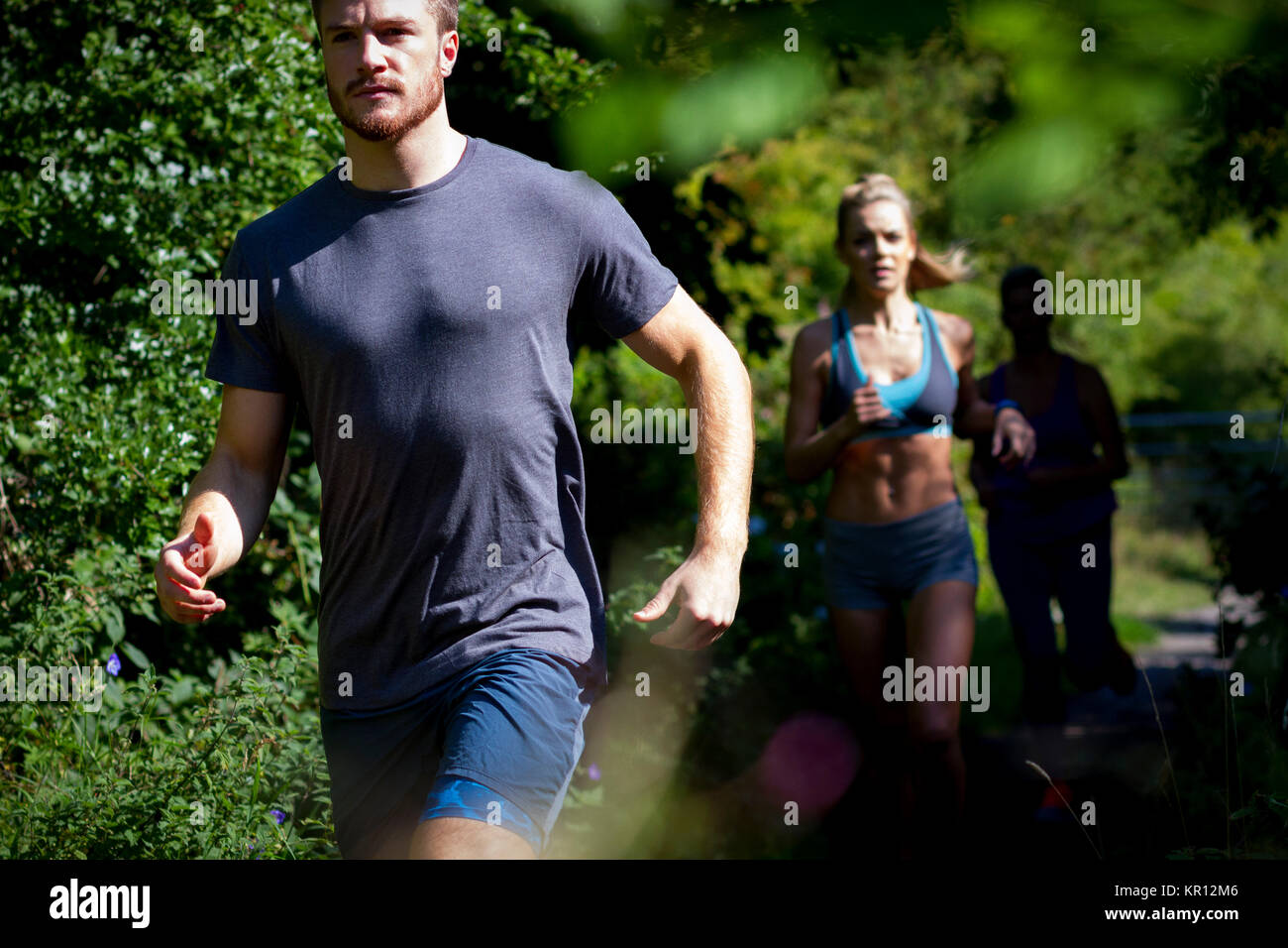 Three People Running Stock Photo - Alamy