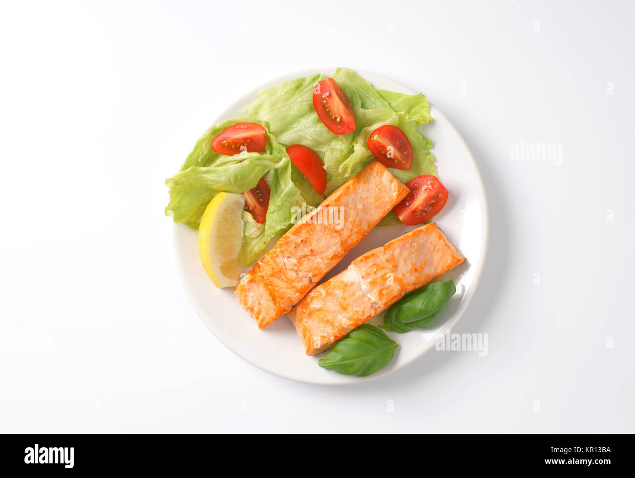 salmon fillets with vegetable garnish Stock Photo - Alamy