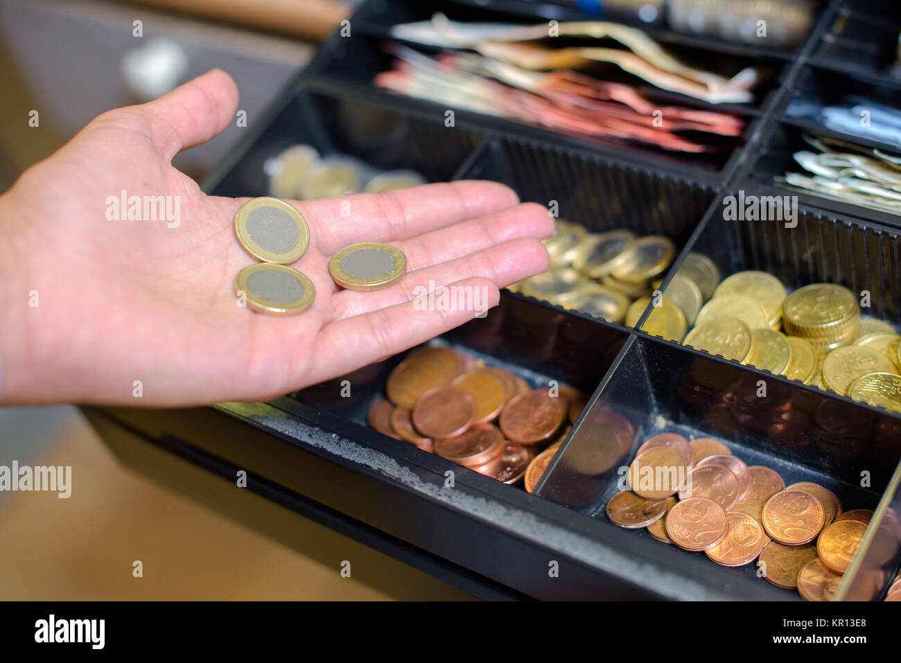 Euro coin on hands hi-res stock photography and images - Alamy