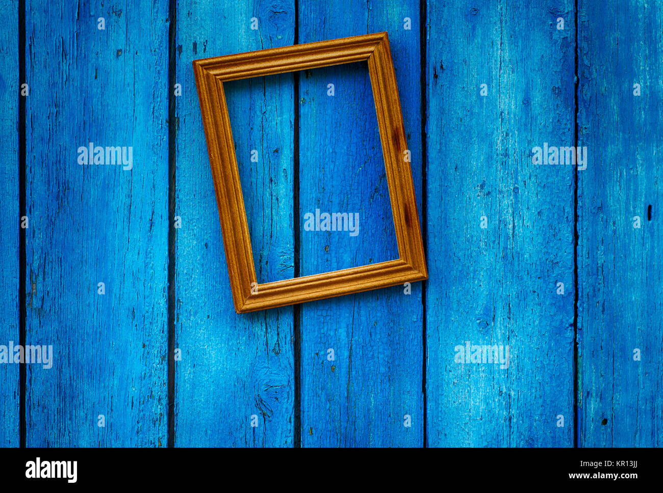 Empty wooden frame on the blue wall Stock Photo - Alamy