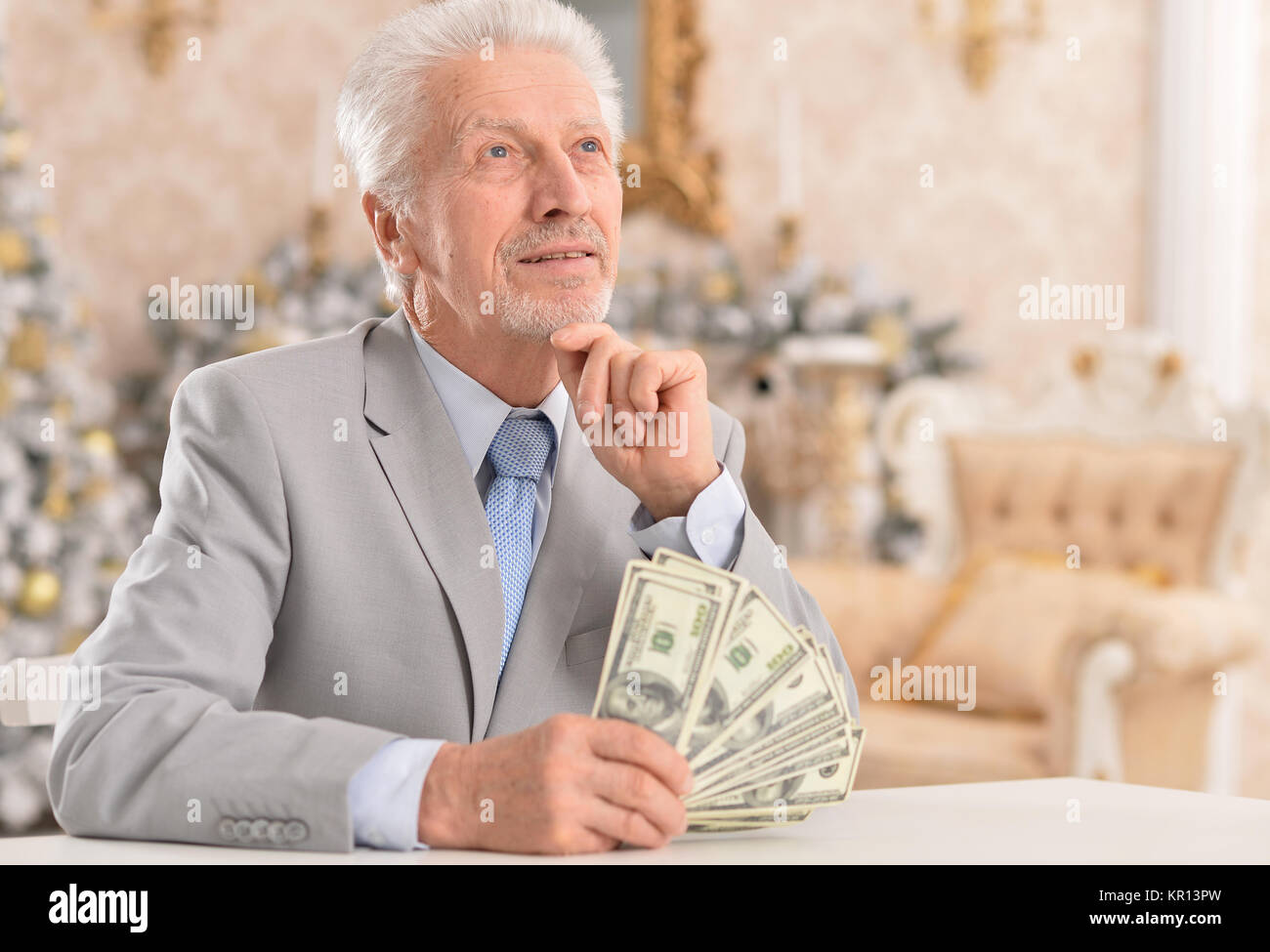 Middle aged man counting money hi-res stock photography and images - Alamy