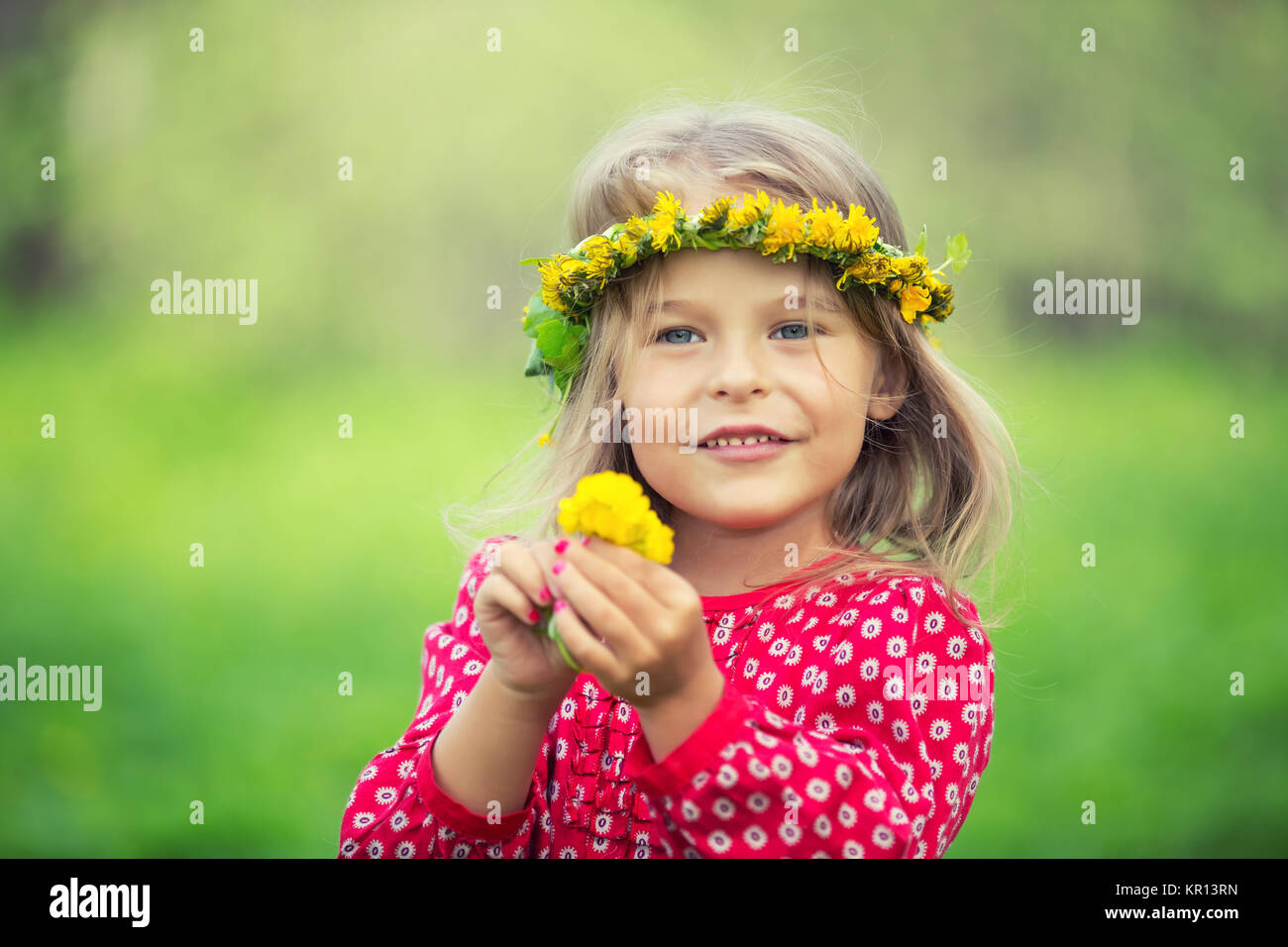 Little girl in spring park Stock Photo - Alamy