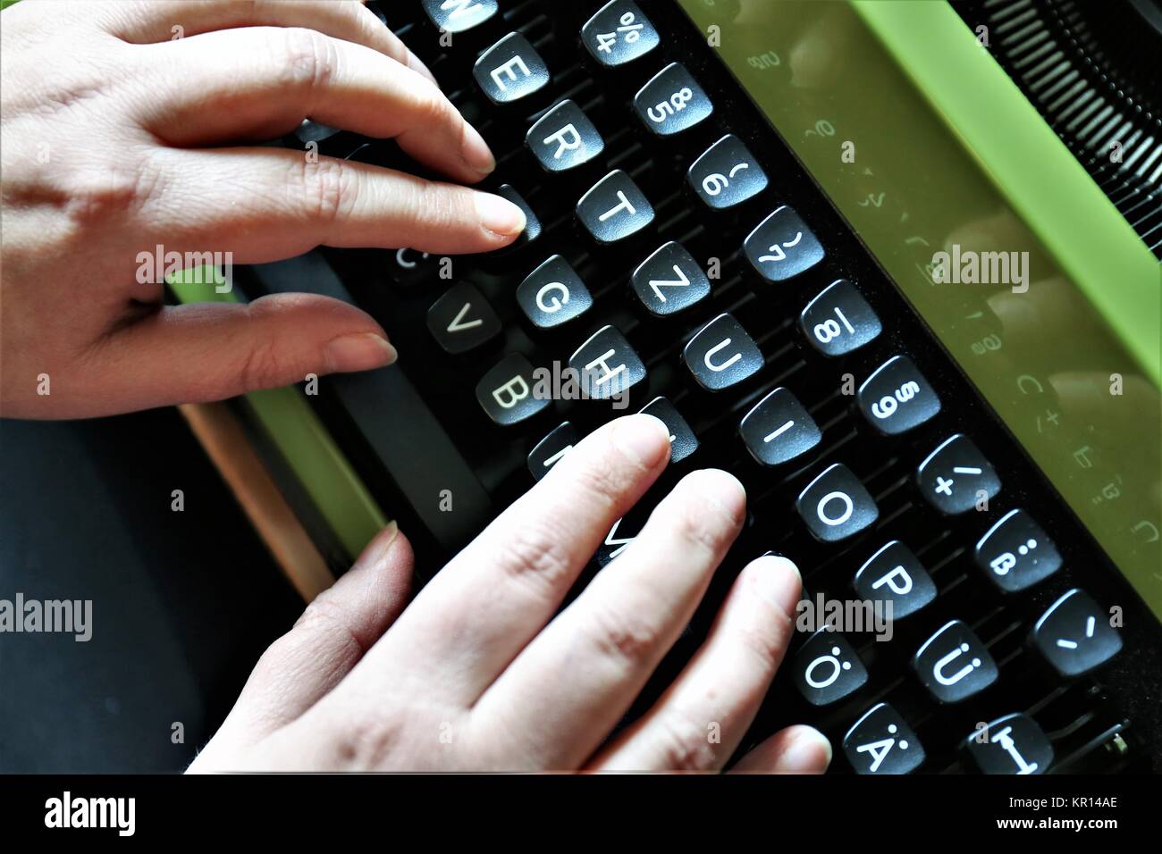 An Image of a vintage typewriter with hands Stock Photo - Alamy