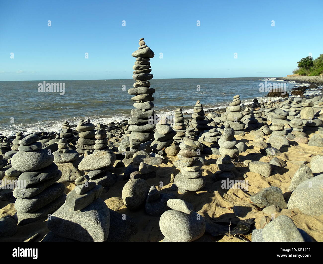 Stone towers on a pebble beach Stock Photo - Alamy