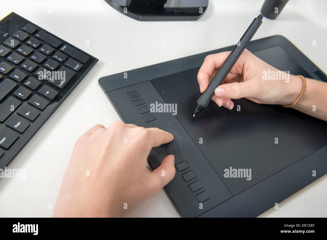 Drawing on graphics tablet close hi-res stock photography and images ...