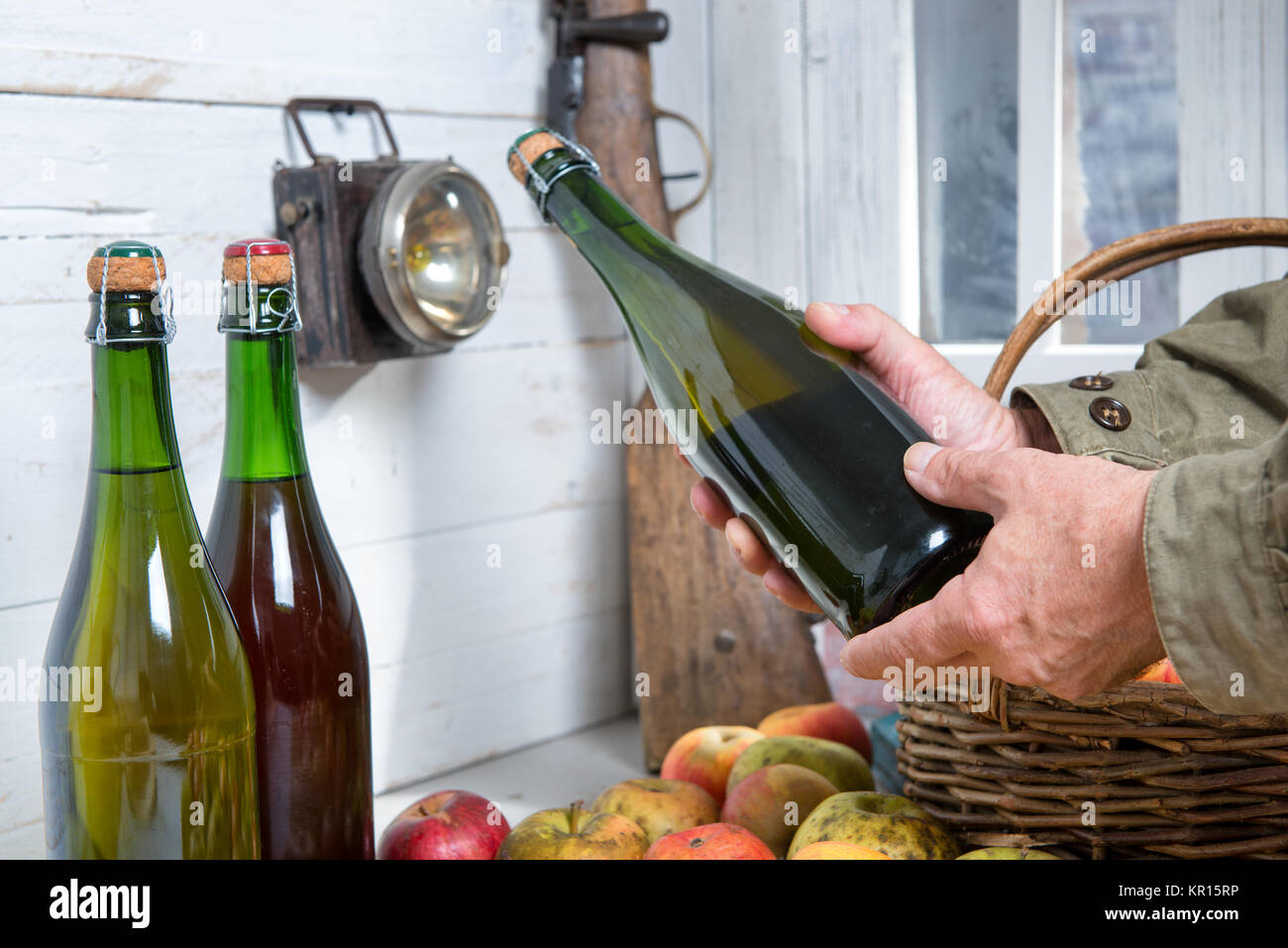 a man with a bottle of cider, close-up Stock Photo - Alamy