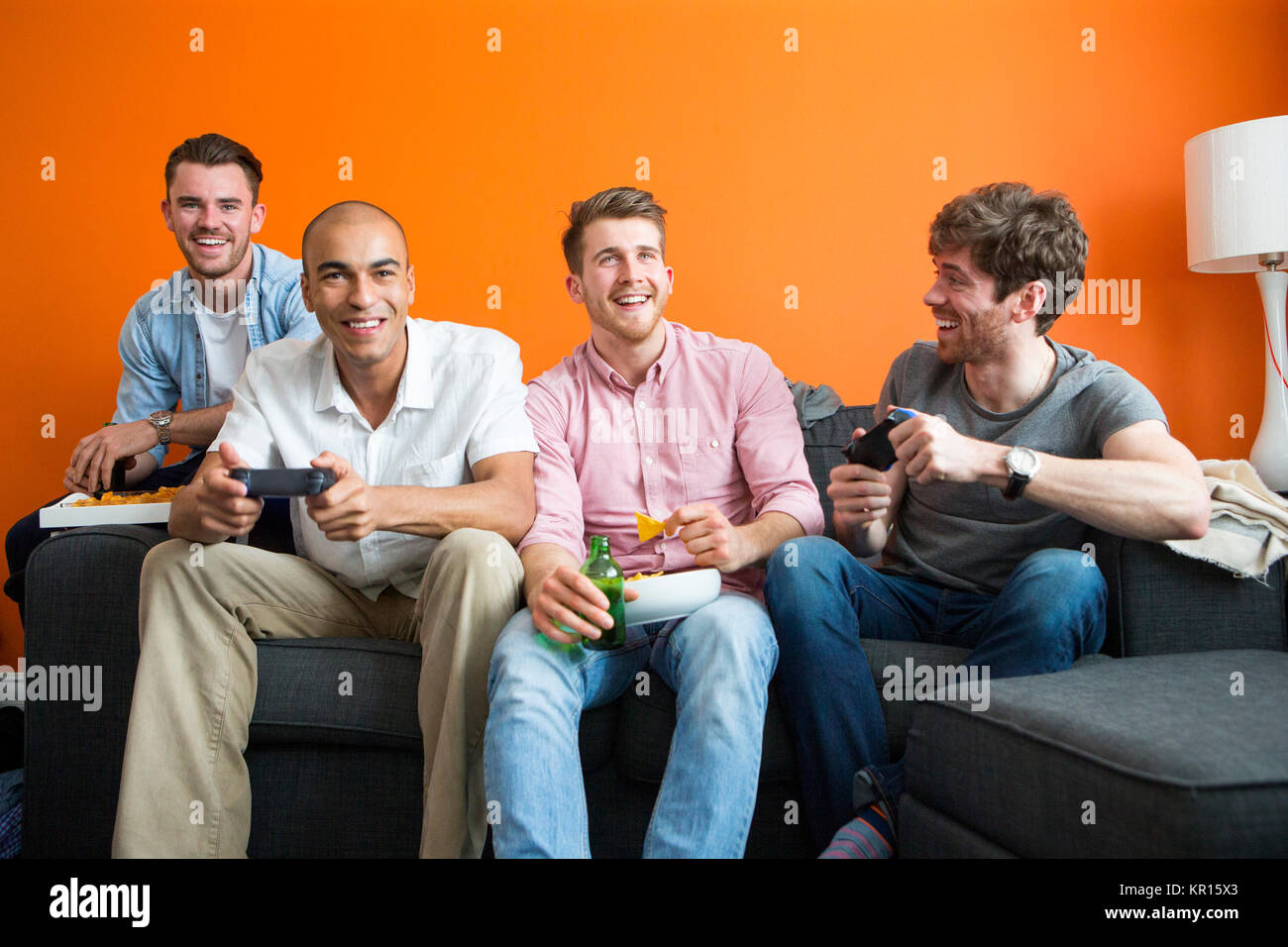 Guys playing video games Stock Photo - Alamy
