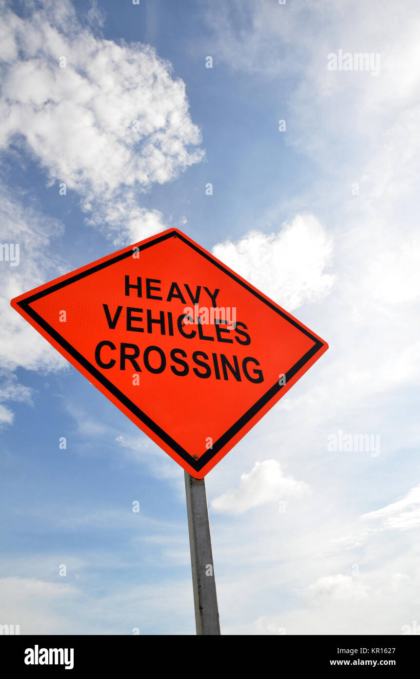 Road sign with a Heavy Vehicles Crossing Stock Photo - Alamy
