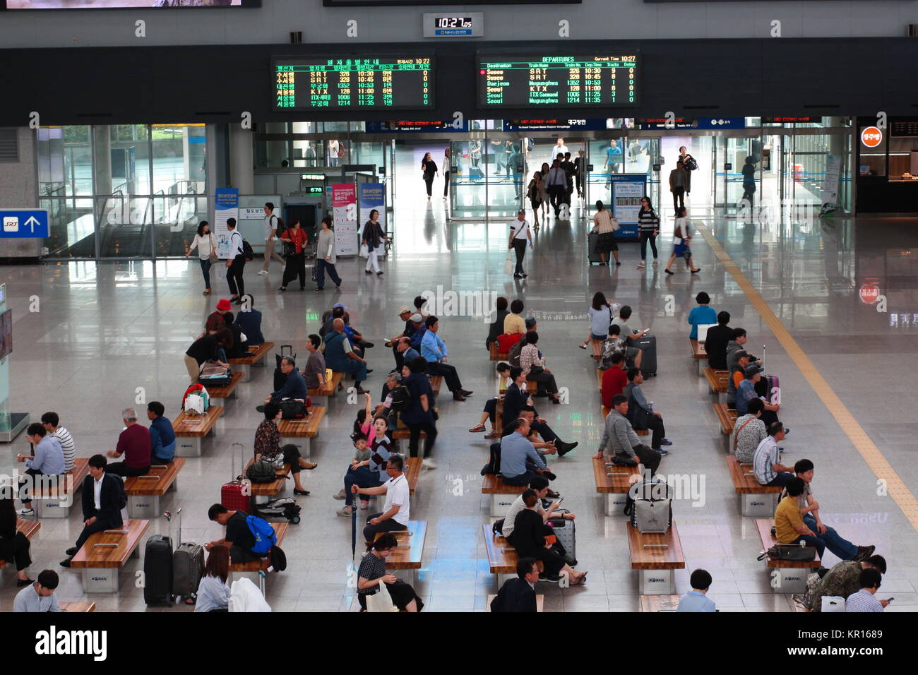 Crowd of people inside Busan Station. Busan Station is a main train ...