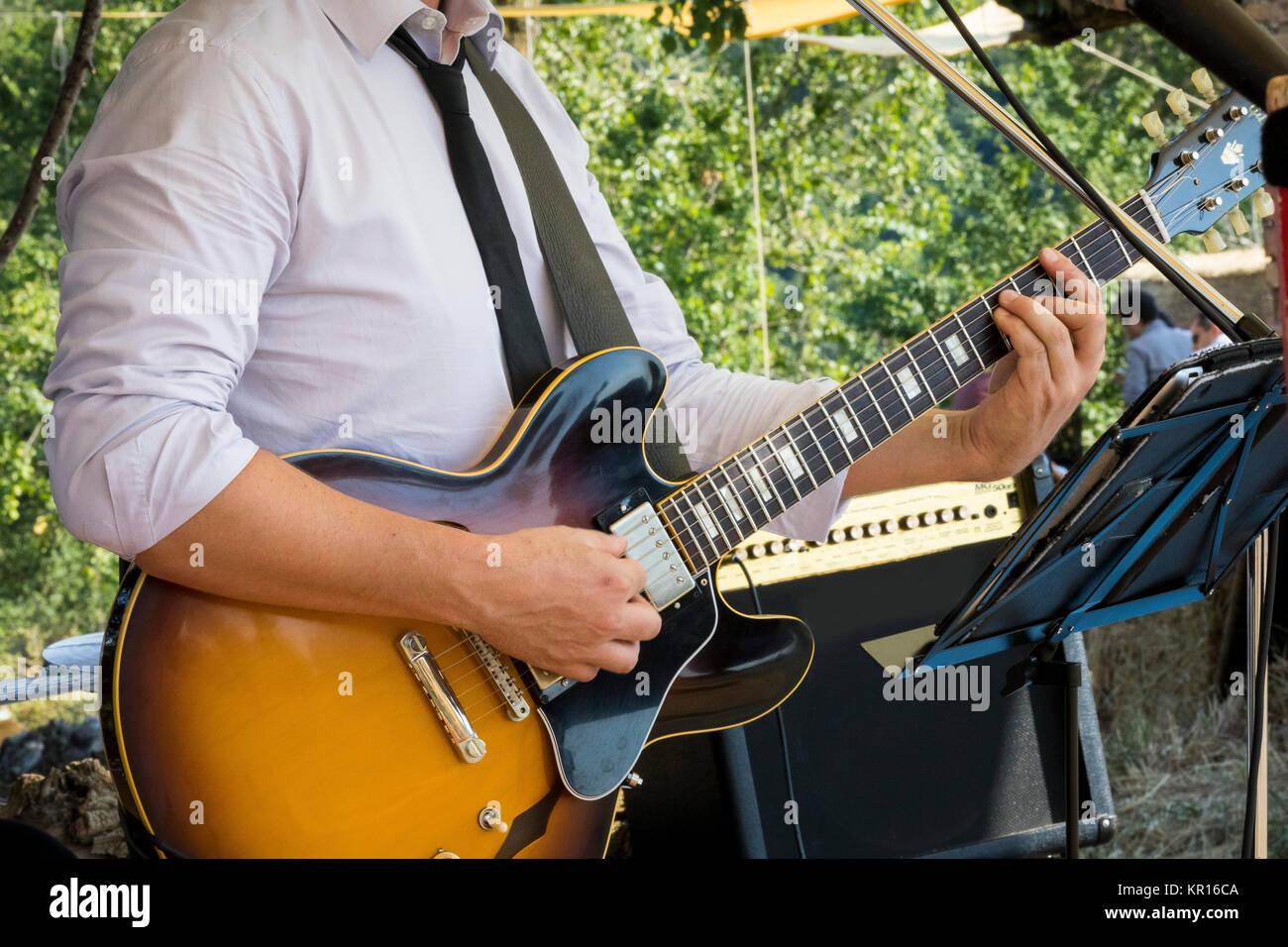 Musician playing electric guitar Stock Photo - Alamy