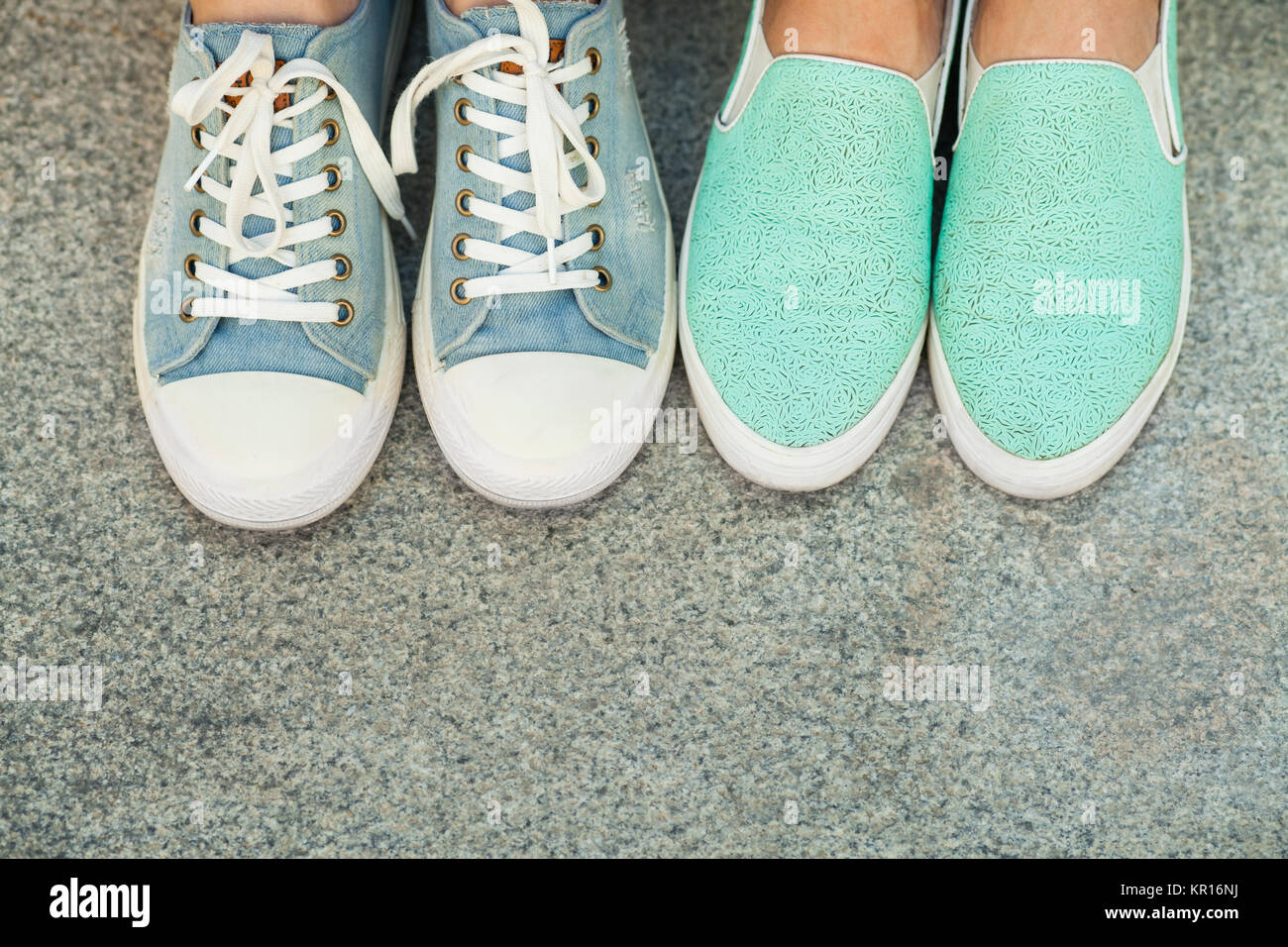 Two pairs feet in sneakers hi-res stock photography and images - Alamy