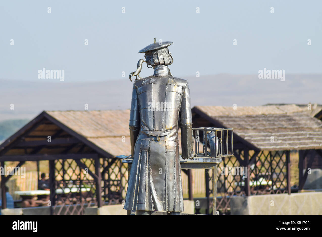 Statue of a furrier from metal with a rat in a cage Stock Photo - Alamy