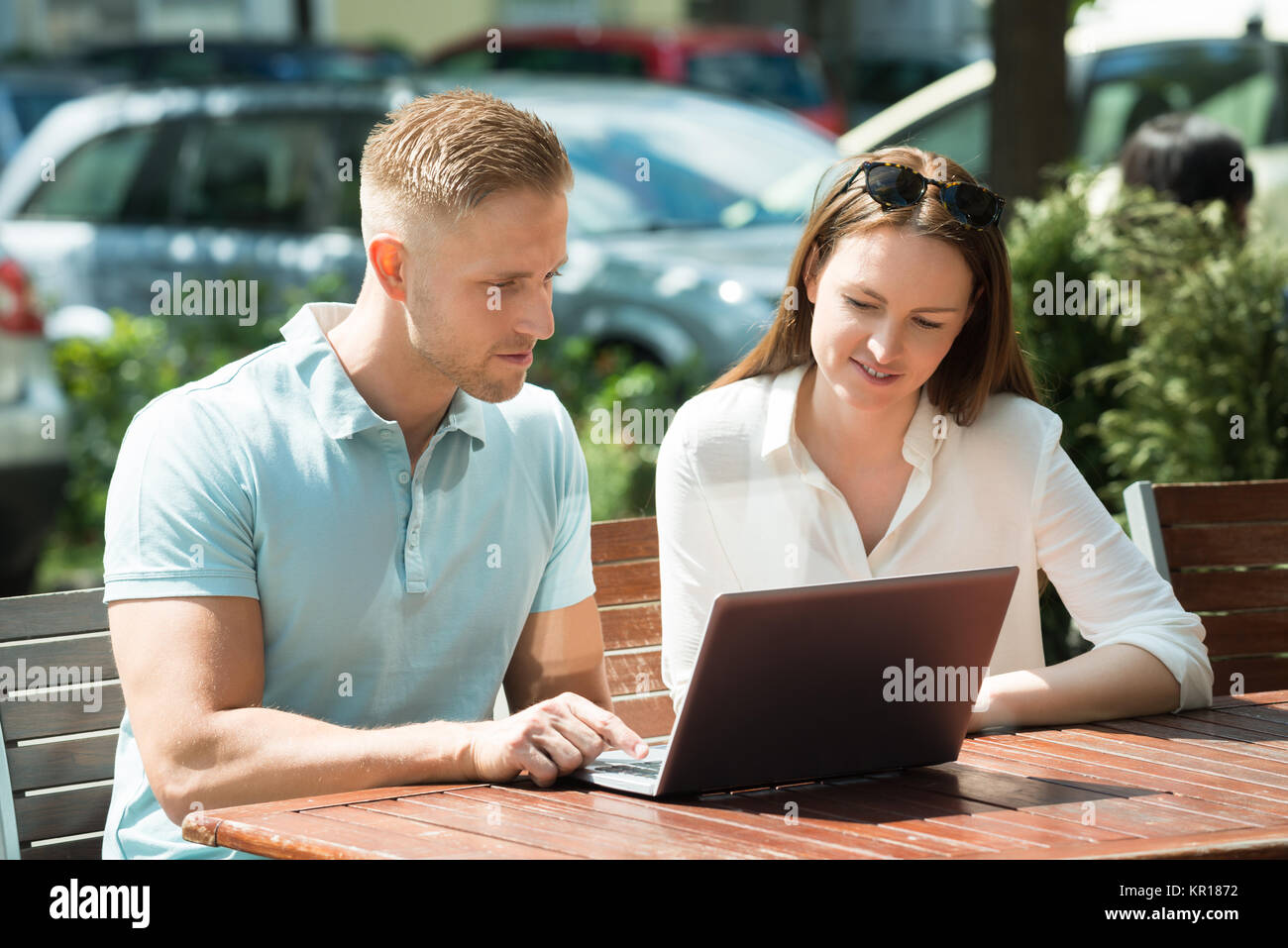 Woman operating laptop outdoors hi-res stock photography and images - Alamy