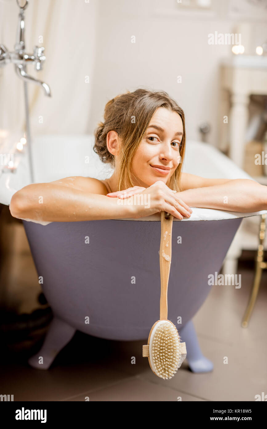 Woman bathing at the retro bathroom Stock Photo - Alamy