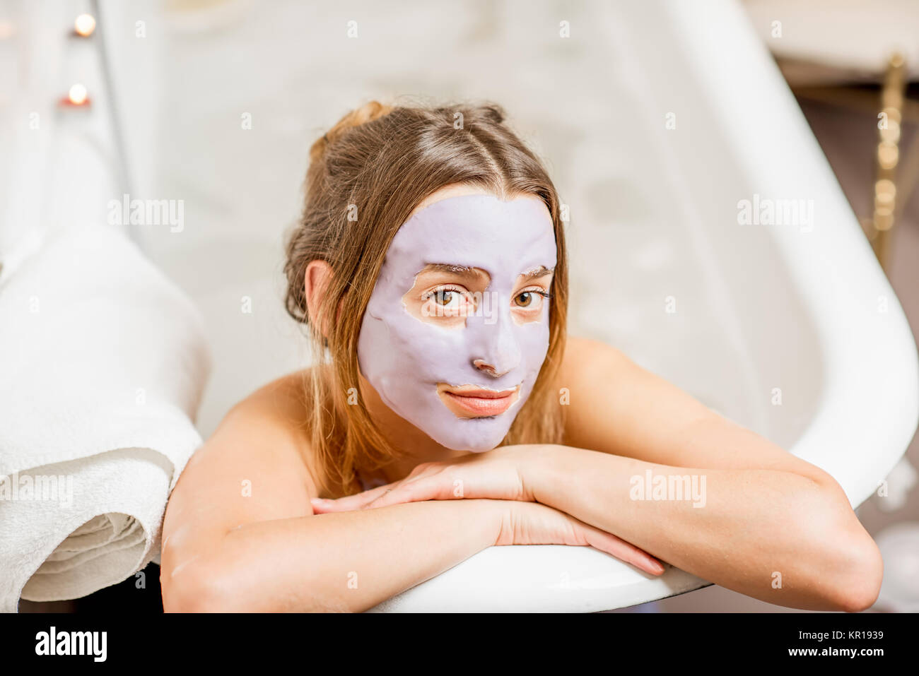 Woman with facial mask in the bathroom Stock Photo - Alamy
