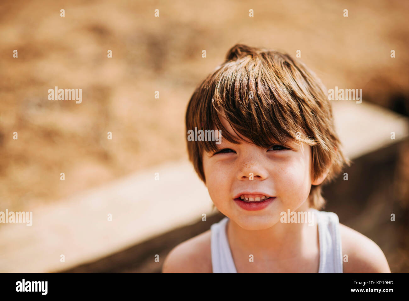 Portrait of a boy at the beach with sand on his face Stock Photo - Alamy