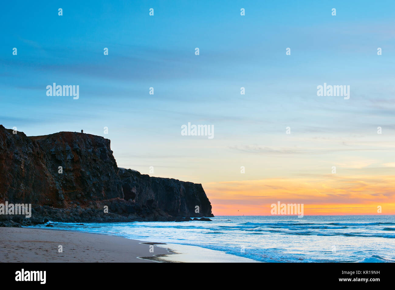 Romantic sunset on the ocean Stock Photo - Alamy
