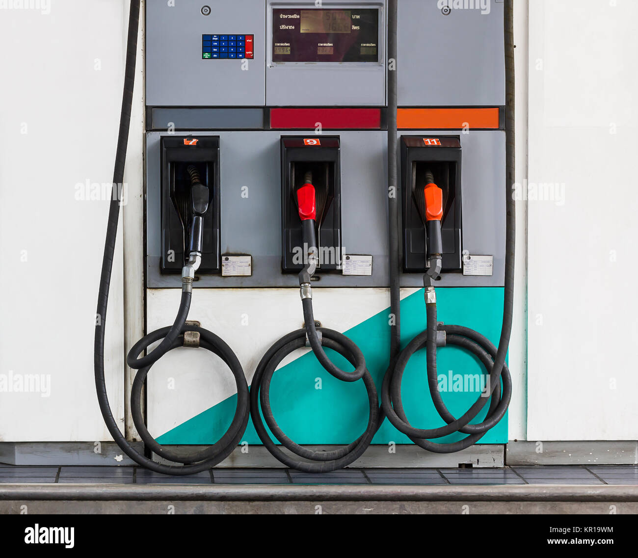 Three refuel nozzles in gas station Stock Photo - Alamy