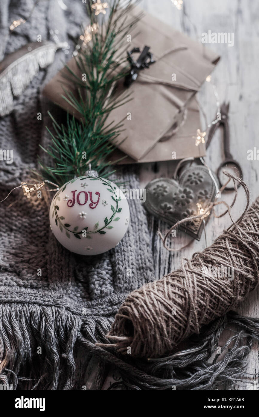 Bauble with the word joy on a wooden table Stock Photo - Alamy