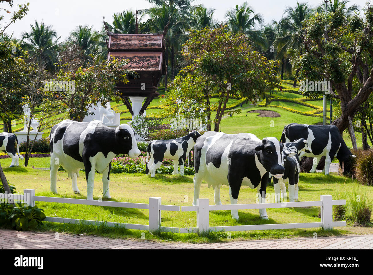 Garden with a statue of cow milk / statue of cow milk Stock Photo - Alamy