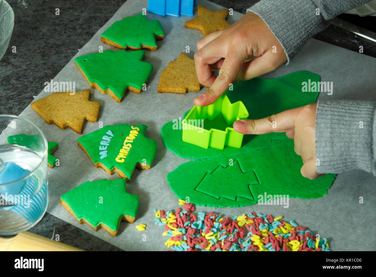 Making homemade christmas cookies, green trees Stock Photo - Alamy