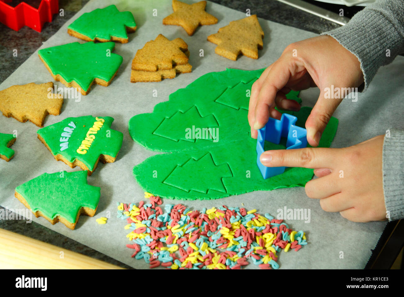 Making homemade christmas cookies, green trees Stock Photo - Alamy