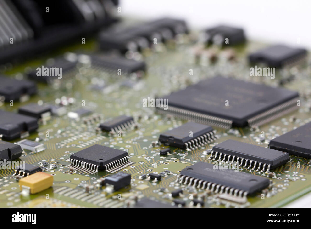 Microchips in a motherboard, electronic components Stock Photo - Alamy