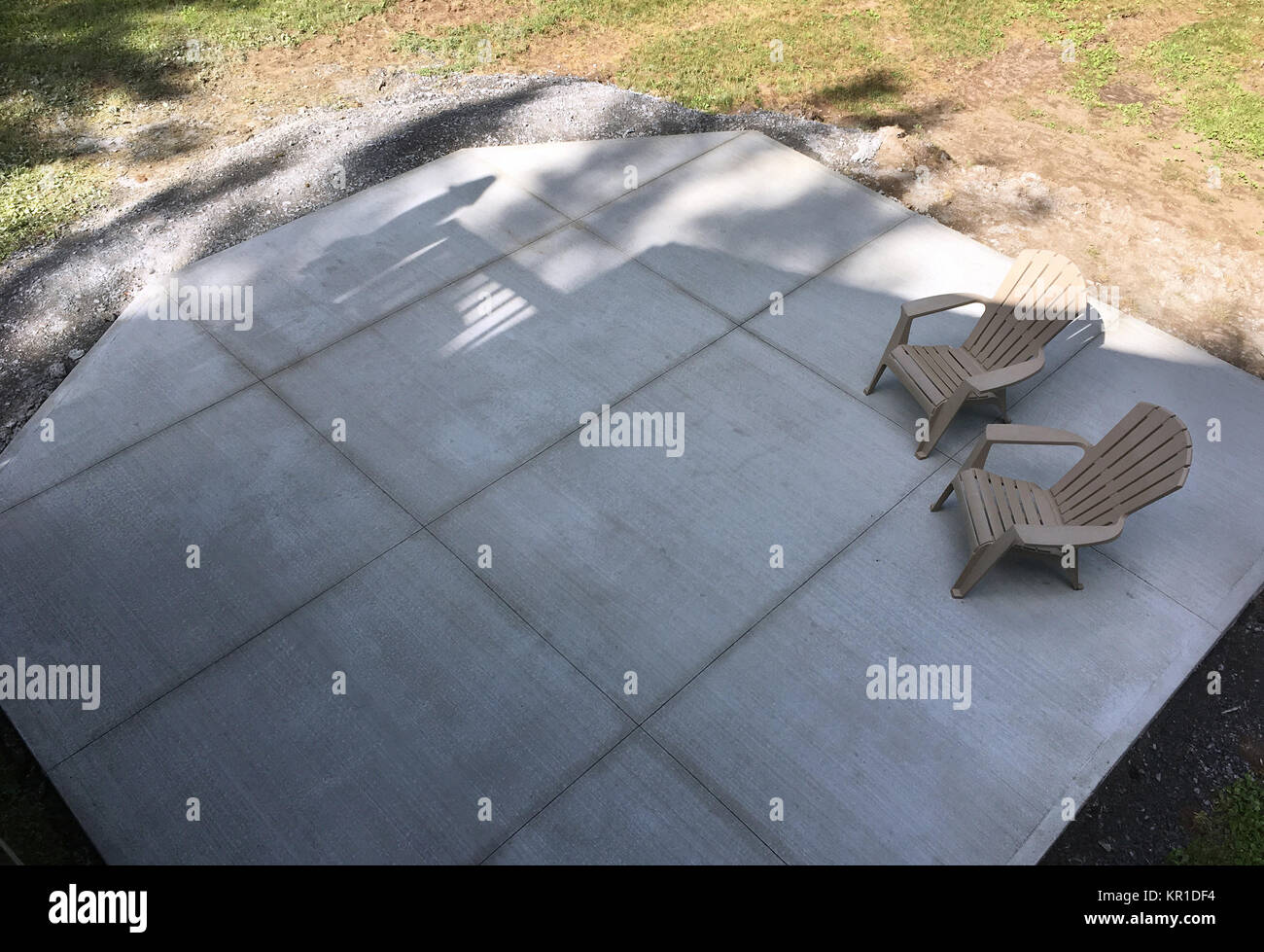 concrete slab with plastic chairs Stock Photo - Alamy
