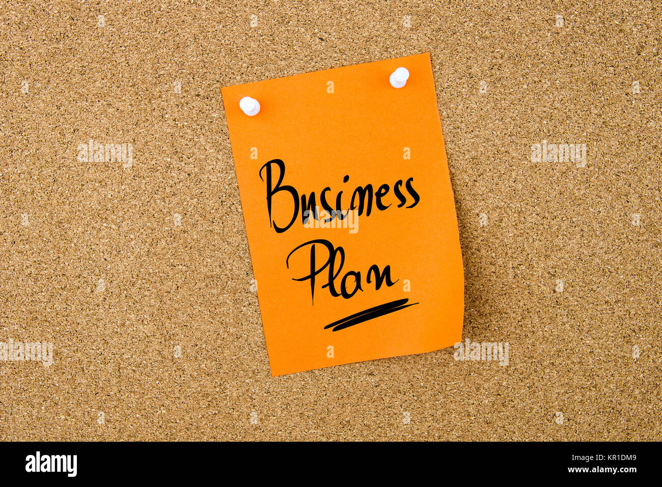Business Plan written on orange paper note Stock Photo - Alamy